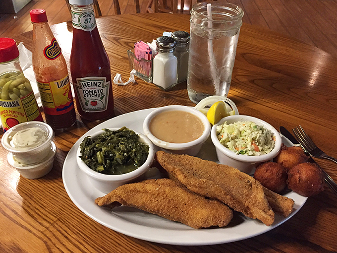 The star of the show: golden-brown catfish with all the fixings. This plate isn't just a meal &ndash; it's a Tennessee tradition on display.