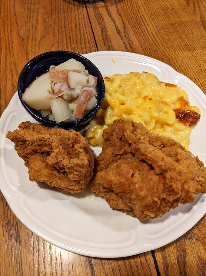 Golden-brown fried chicken that makes you understand why people cross state lines for lunch. The perfect crust-to-juicy-meat ratio is culinary mathematics at its finest.