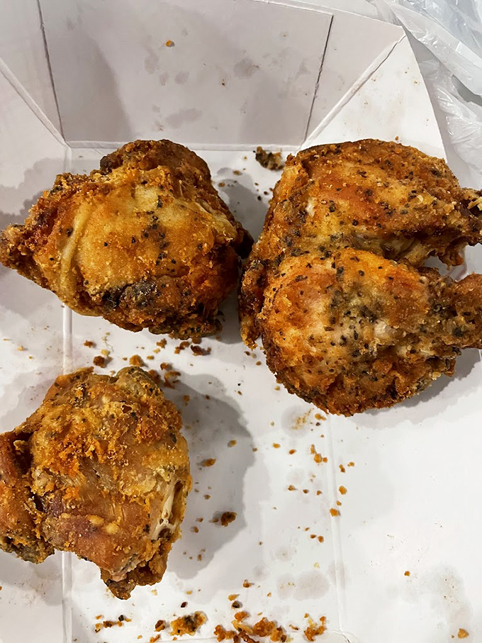 Golden-brown perfection that makes you understand why people drive for hours. This isn't just fried chicken; it's edible nostalgia.