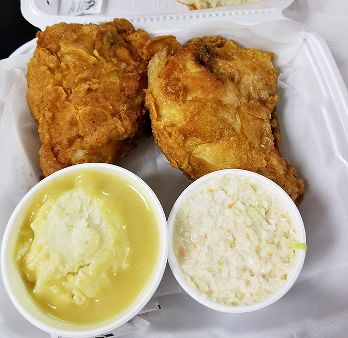 Golden perfection with sides that don't play second fiddle. This chicken's crackling crust gives way to juicy meat while mashed potatoes and slaw provide the harmony.