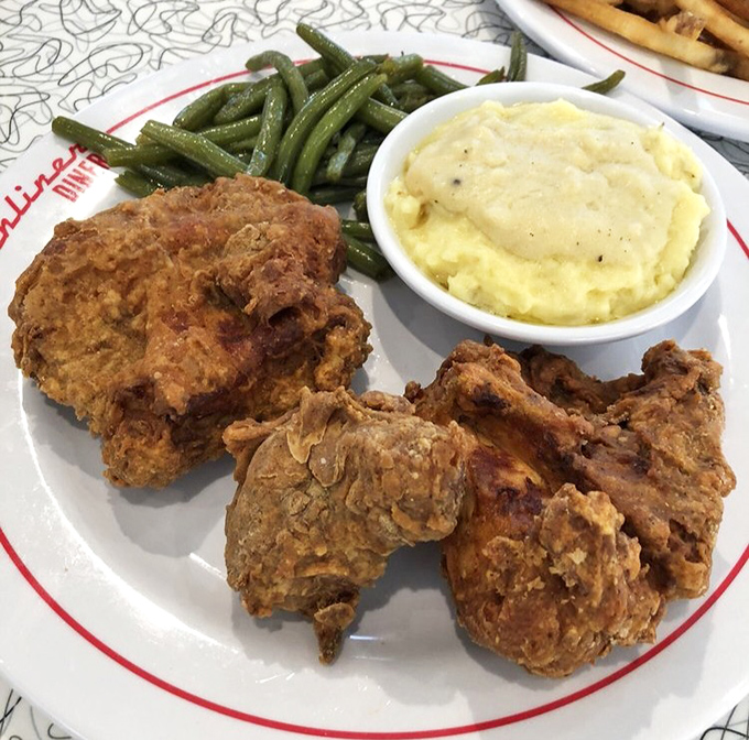 Golden-brown perfection that would make Colonel Sanders weep with envy. This fried chicken's crackling crust hides juicy meat that practically begs for a side of mashed potatoes.