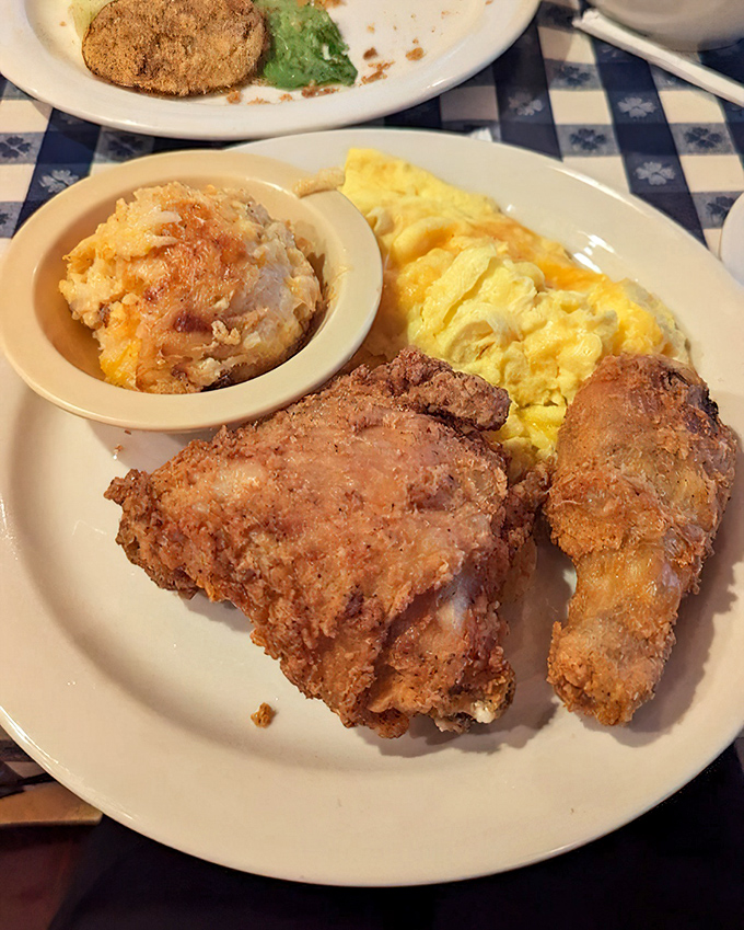 Golden-brown perfection that makes you understand why people drive for hours just for chicken. That crispy exterior hiding juicy meat is worth every mile.