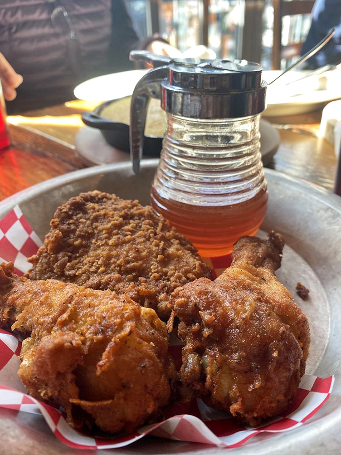 Golden-brown perfection with that signature spicy honey on standby. This isn't just fried chicken&mdash;it's a masterclass in crunch-to-juicy ratio engineering.