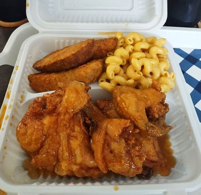 Behold, the star of the show in all its golden glory. This isn't just fried chicken; it's edible artwork with mac and cheese playing a worthy supporting role.