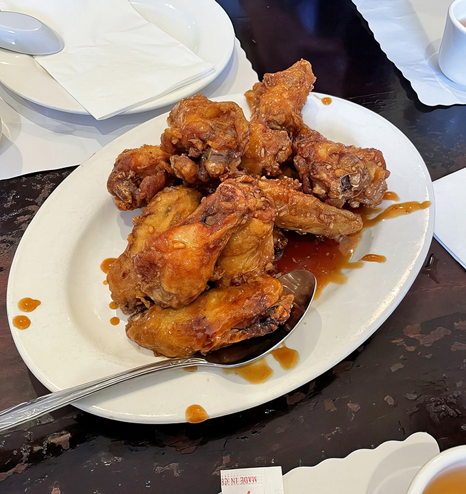Culinary magic happens when perfectly fried chicken meets San Tung's sticky-sweet-spicy glaze. One bite and you'll understand why these wings have their own fan club.