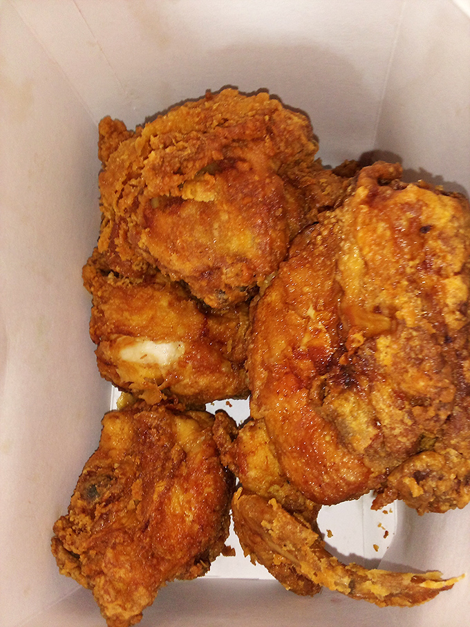 Golden-brown perfection in a box. This isn't just fried chicken—it's edible evidence that simplicity, when done right, is the highest form of culinary art.
