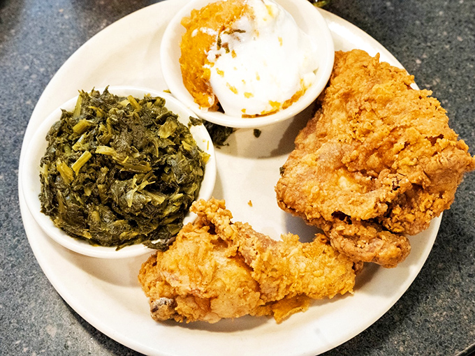 Golden-crusted perfection alongside greens and creamed potatoes &ndash; the holy trinity of comfort food done right.