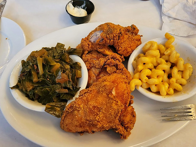 The holy trinity of Southern comfort: golden-crisp fried chicken, collard greens with just the right tang, and mac & cheese that would make your grandma jealous.