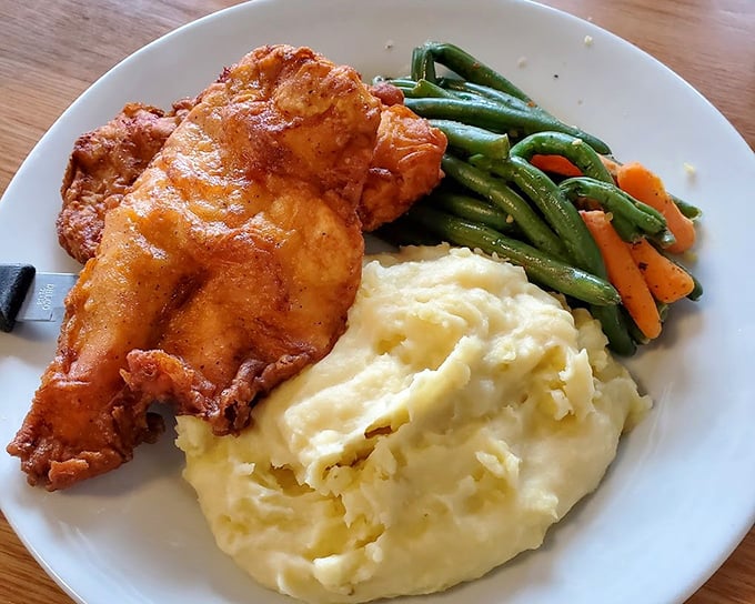 Golden-brown perfection that makes other fried chicken weep with inadequacy. That crispy exterior gives way to juicy meat that might just ruin you for all other versions.