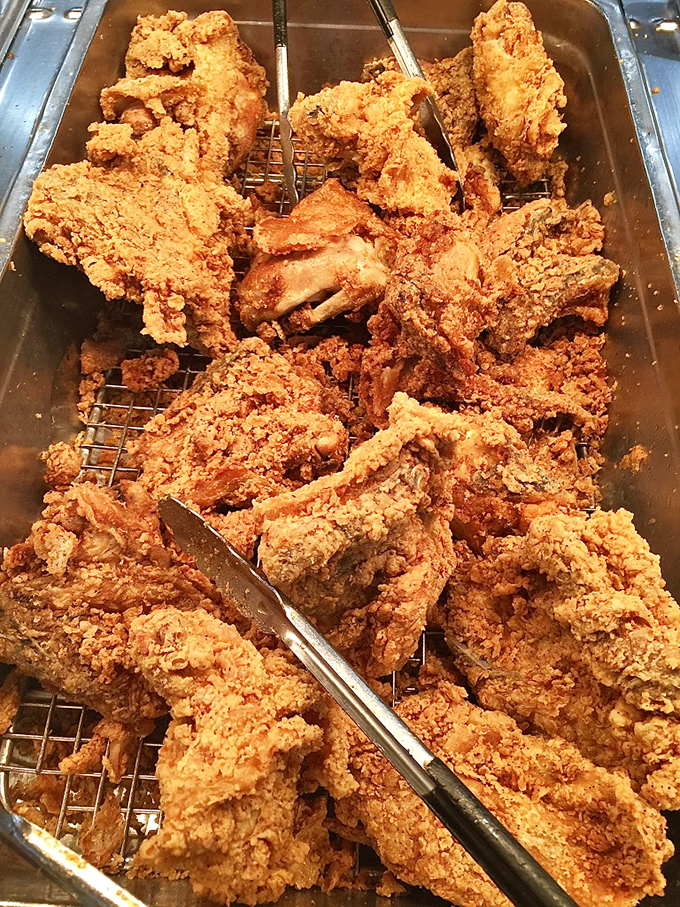 Golden, crispy, and piled high like edible treasure &ndash; this is what fried chicken dreams are made of, folks.