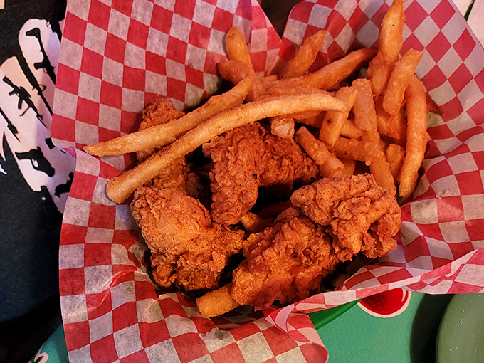 Golden-brown perfection arrives in a checkered basket, each tender looking like it graduated with honors from frying school.