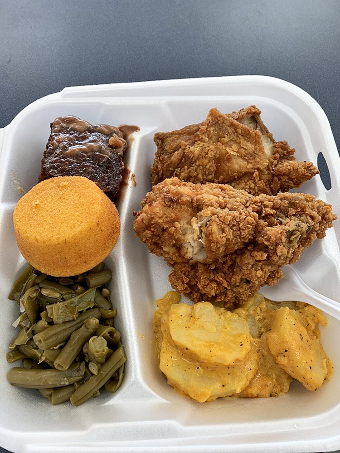 This isn't just fried chicken; it's edible poetry with a crispy coating. The kind that makes you close your eyes and momentarily forget your table manners.