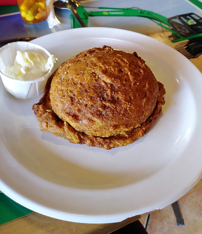 Golden-brown sweet potato pancakes that look like they were kissed by Southern sunshine, served with a dollop of butter that's already starting to melt.