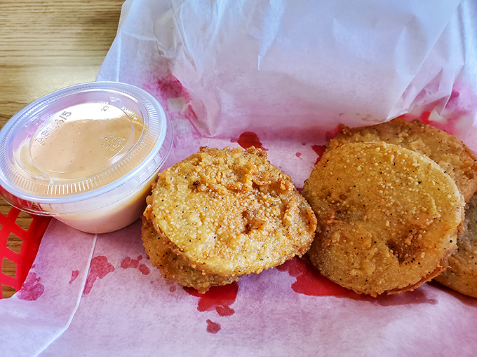 Golden-brown discs of Southern perfection. These fried green tomatoes achieve that magical balance of crispy exterior and tangy interior that makes you forget vegetables are supposed to be healthy.
