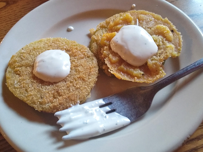 Golden perfection achieved &ndash; these fried green tomatoes with their crispy coating and dollop of ranch are worth the drive alone.