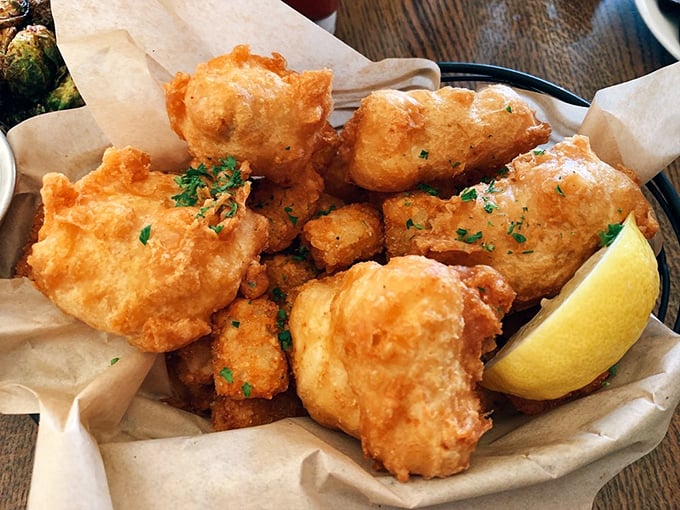 Golden-battered halibut that shatters with each bite, revealing pearly white flesh within. This isn't just fried fish&mdash;it's Alaska's maritime treasure transformed.