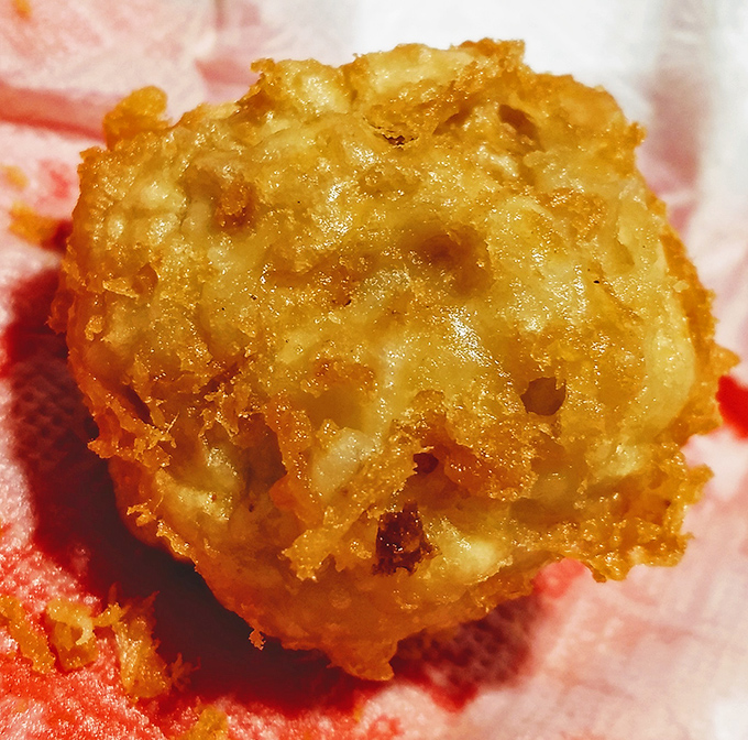 These golden-fried mushrooms aren't trying to win any beauty contests, but one bite of that crispy exterior gives way to a juicy interior that's pure joy.