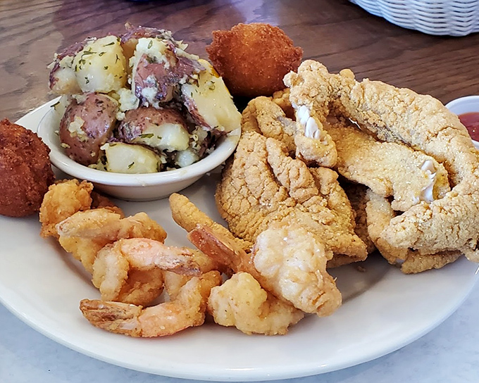 Not all heroes wear capes &ndash; some arrive on white plates with golden-fried shrimp, catfish, and potato salad. A Mississippi feast worth every calorie.