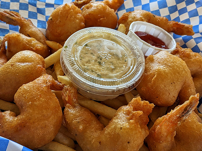 Golden-fried treasures from the deep, wearing their coconut armor with pride. The dipping sauce is just showing off.