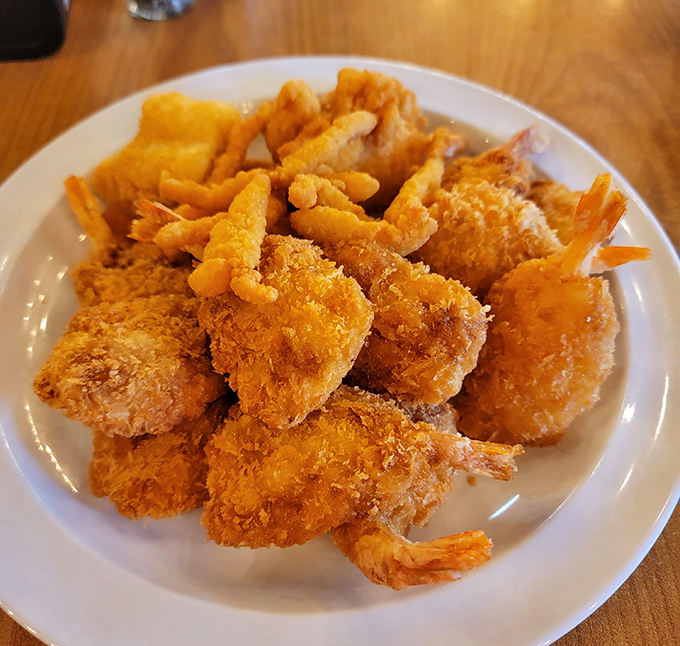Golden-fried shrimp piled high—each one a crispy, succulent morsel that makes you wonder why you'd ever settle for those sad frozen imposters.