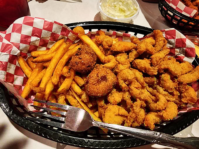 Golden-fried shrimp and hushpuppies nestled beside crispy fries&mdash;proof that sometimes the simplest pleasures deliver the most satisfaction.