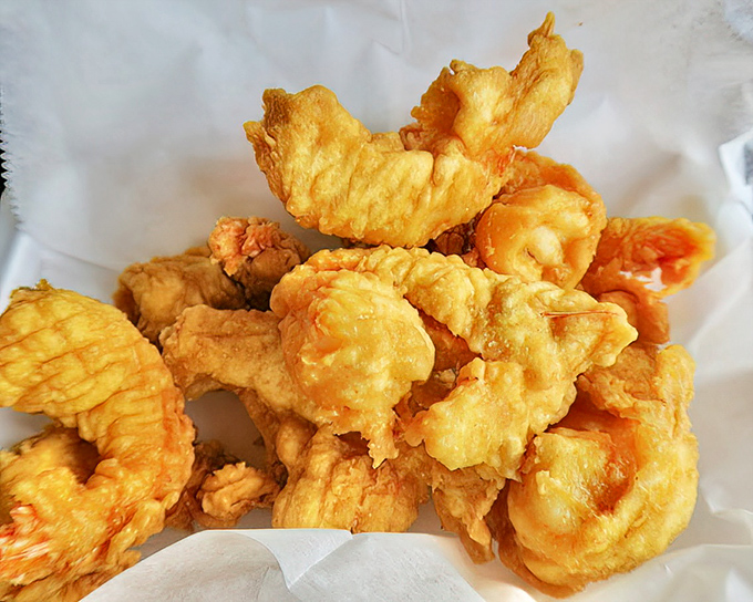 Golden-battered shrimp that crunch like your favorite childhood memories. The kind of fried perfection that makes you forget counting calories exists.