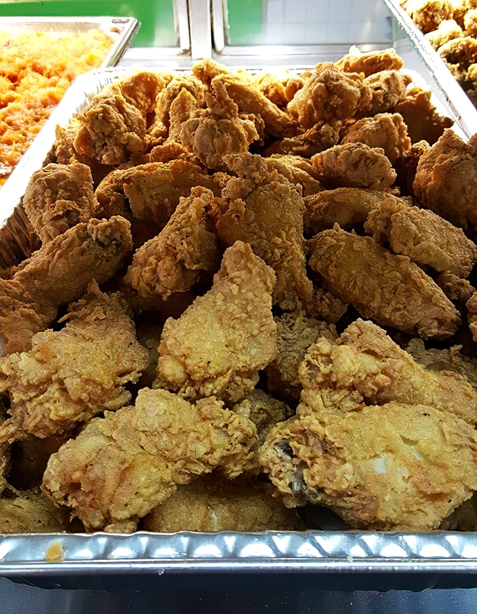 Golden mountains of fried chicken waiting for their forever homes. That crust has more layers than a Tennessee Williams play.