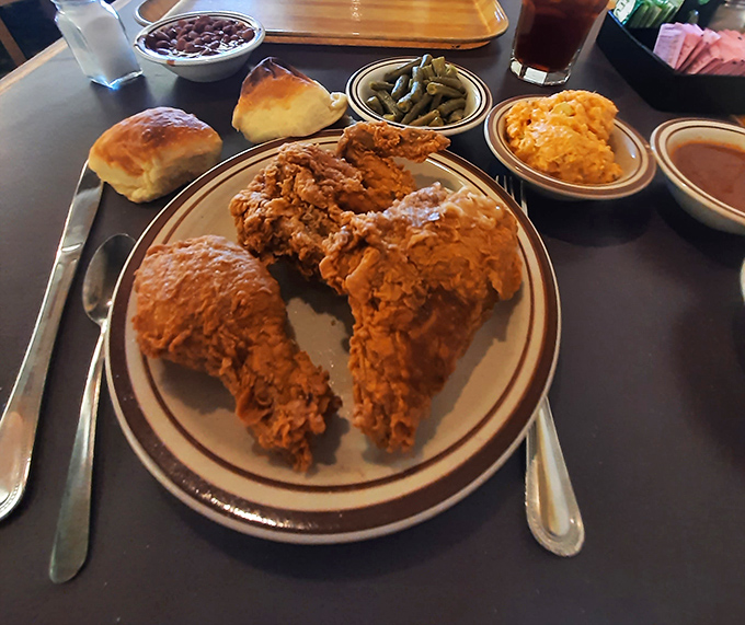 Golden-brown fried chicken that makes such a satisfying crunch, nearby conversations pause momentarily in reverent appreciation.