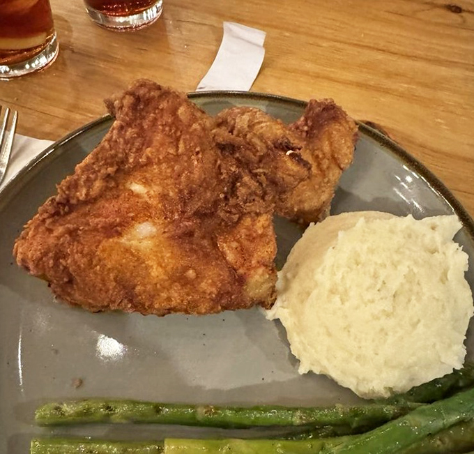 Golden-brown fried chicken that makes Colonel Sanders look like an amateur. That crust should win awards for architectural integrity.