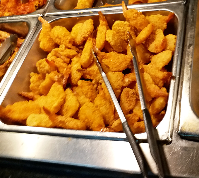 Golden fried shrimp standing at attention like delicious soldiers ready to march straight into your heart.
