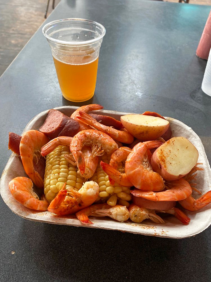 Lowcountry boil perfection: plump shrimp, smoky sausage, sweet corn, and potatoes that have soaked up the sea's essence. Fork optional, napkins mandatory.