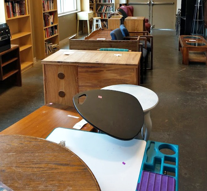 The furniture section&mdash;where mid-century modern pieces mingle with practical desks, and every item whispers, "Take me home for less than you'd spend on dinner for two."