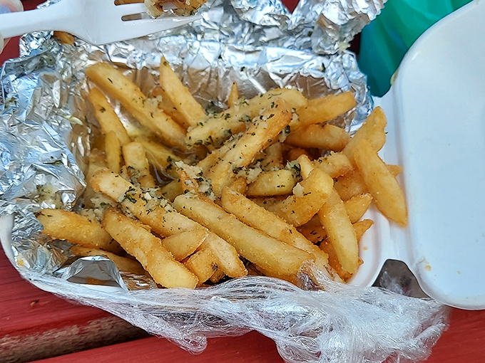 These aren't just garlic fries &ndash; they're a religious experience wrapped in foil, glistening with buttery, herbaceous perfection.