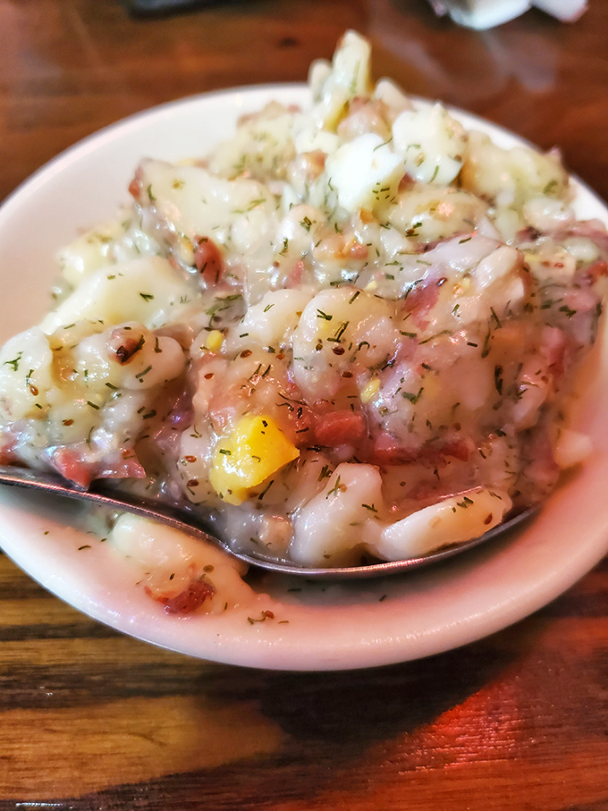 This isn't your aunt's mayo-drenched potato salad. Ron's German version, with its vinegary tang and bacon bits, might just change your potato paradigm forever.