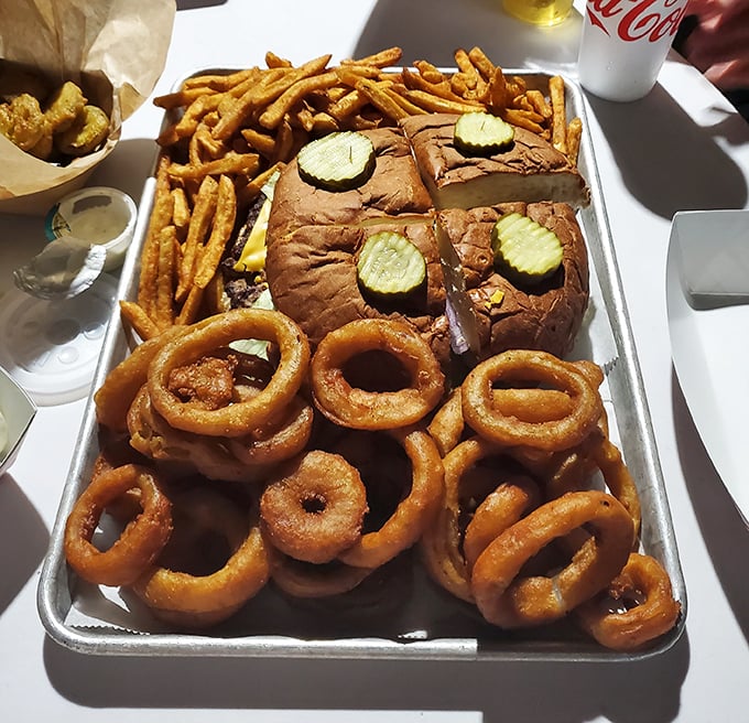 This isn't just a burger&mdash;it's an edible monument to excess, complete with a regiment of onion rings standing guard. Your diet doesn't stand a chance.