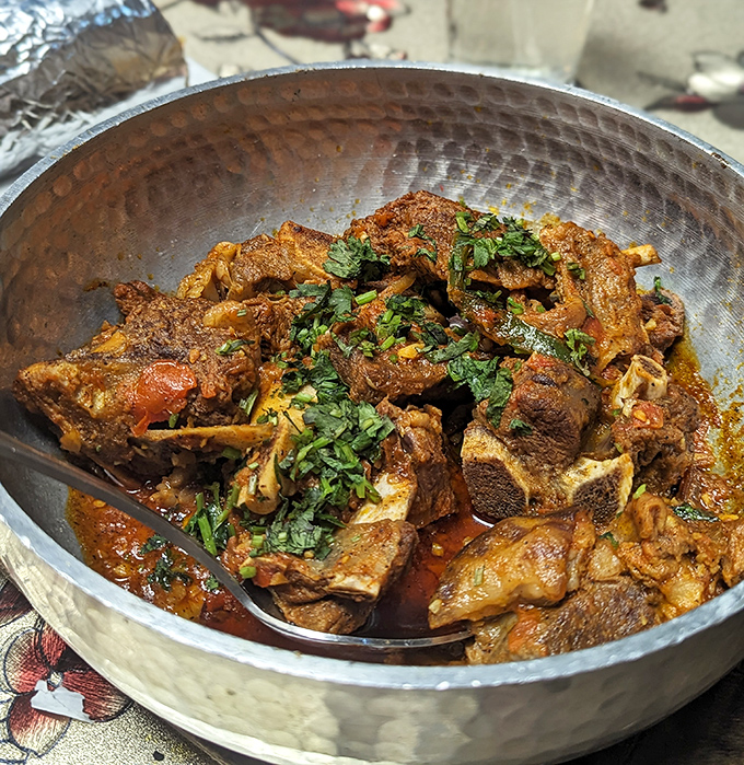 Goat Shinwari in its traditional karahi&mdash;tender, spiced, and proof that some cooking vessels are iconic for good reason.