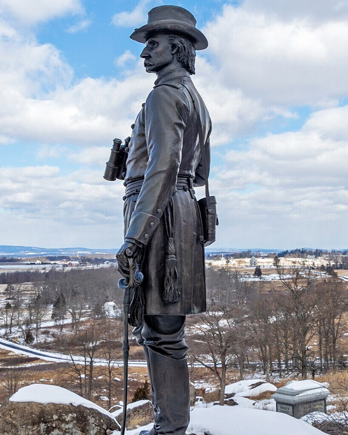 Standing sentinel over the battlefield, this bronze soldier gazes across the landscape where history was written, offering a powerful reminder of sacrifice.