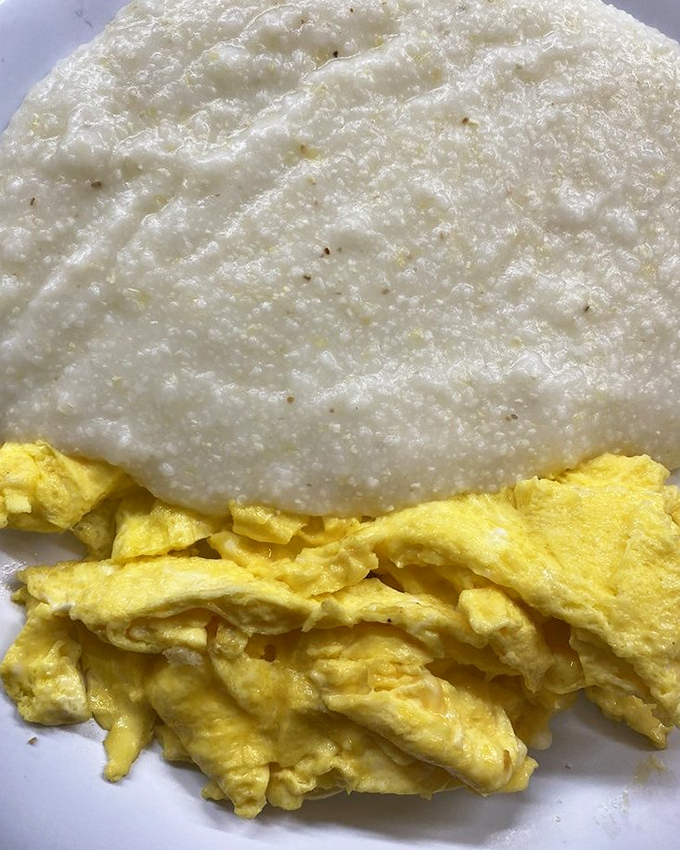 Behold the perfect marriage: creamy grits alongside scrambled eggs so fluffy they practically need their own zip code.