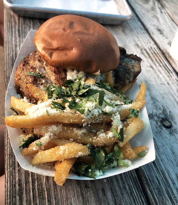 The star of the show in all its glory! This blackened grouper sandwich with herb-dusted fries isn't just a meal&mdash;it's a Florida rite of passage.