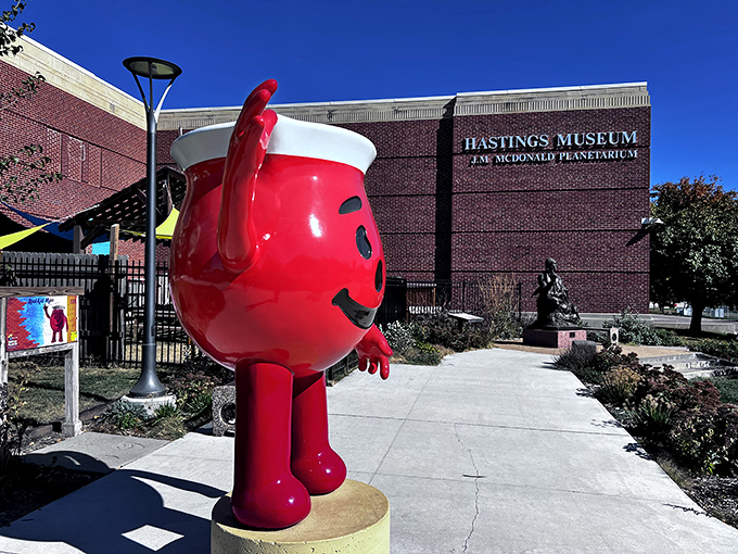 The Kool-Aid Man stands guard at Hastings Museum, a cheerful reminder that this town invented the drink that's been staining children's tongues for generations.