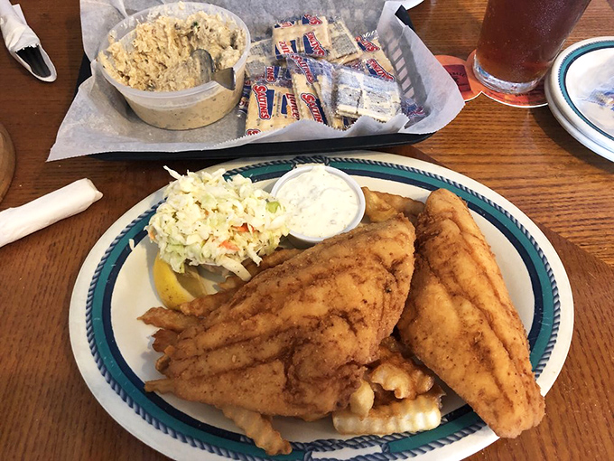 Behold the legendary hogfish platter &ndash; golden, crispy perfection that's earned this place its statewide reputation for seafood excellence.