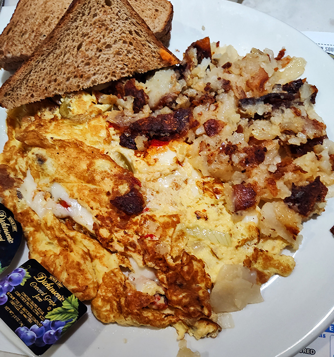 The holy trinity of breakfast perfection: golden eggs, crispy home fries, and toast that knows its purpose. Simple food done extraordinarily well.