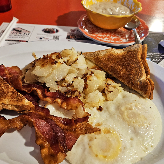 Breakfast perfection doesn't require fancy techniques&mdash;just perfectly crispy home fries, eggs with golden yolks, and bacon that would make vegetarians question their life choices.
