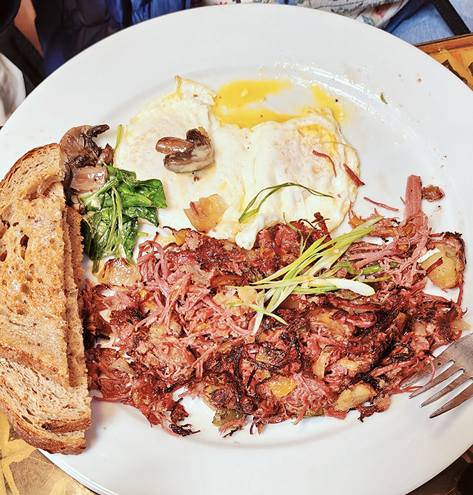 Corned beef hash that makes you question all other breakfast commitments you've ever made. Those eggs are having the time of their lives.