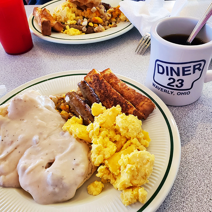 Breakfast of champions! Golden scrambled eggs, perfectly browned sausage links, and country gravy that would make your grandmother nod in approval.