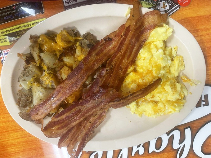 Breakfast perfection on a plate &ndash; crispy bacon, fluffy scrambled eggs, and hash browns that strike that magical balance between crispy exterior and tender interior.