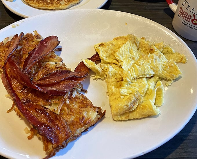 This is what breakfast dreams are made of&mdash;crispy hash browns, perfectly cooked eggs, and bacon that would make vegetarians reconsider their life choices.