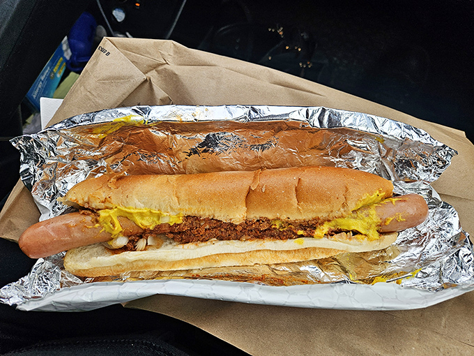 This isn't just a hot dog&mdash;it's a masterpiece of mustard, chili, and cheese that requires both hands, several napkins, and absolutely zero regrets.