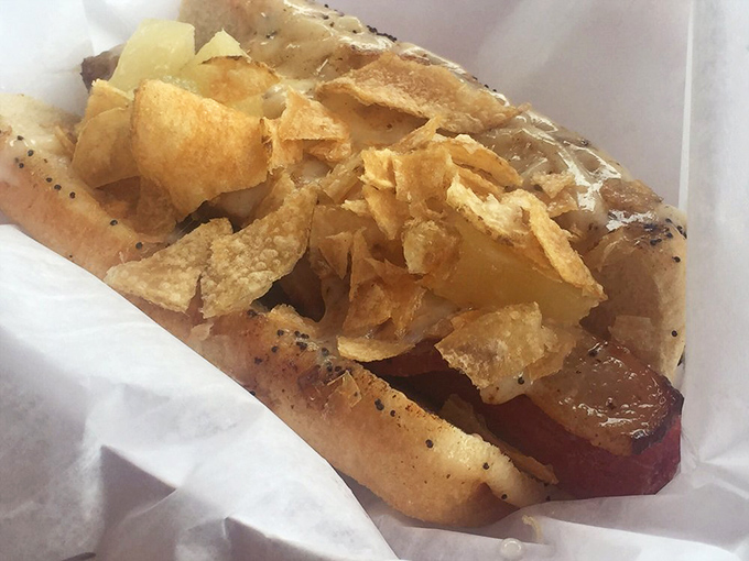 Potato chips adding unexpected crunch to this hot dog creation. It's like someone took your childhood lunch and gave it a delicious upgrade.