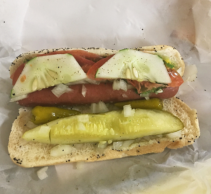 This isn't just a hot dog&mdash;it's Chicago on a bun. The pickle spear stands at attention like a guardian of proper hot dog etiquette.